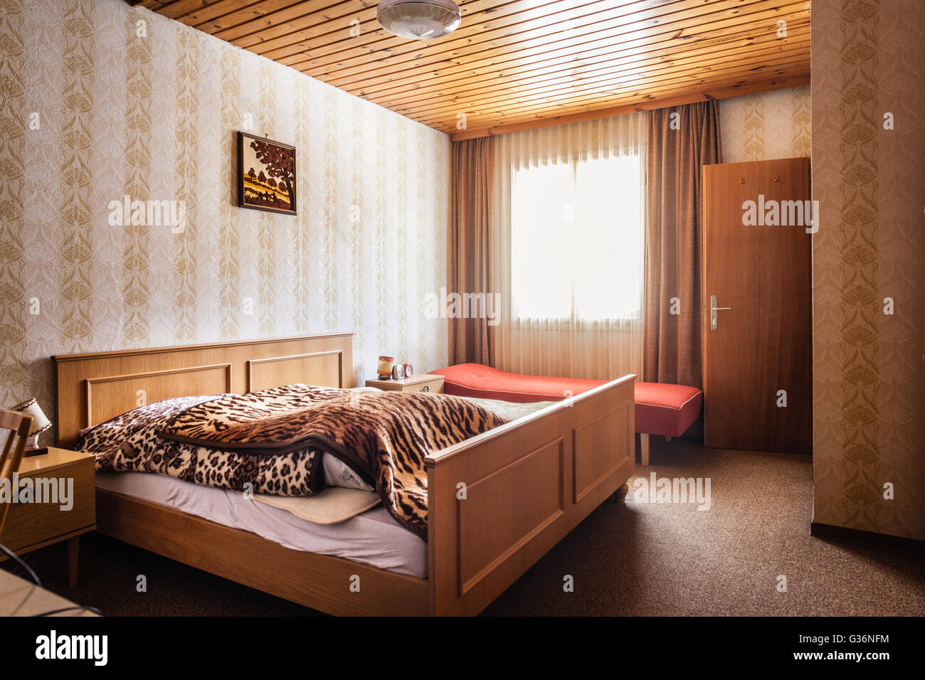 a warm bedroom in the morning with the sunlight shining through the ...