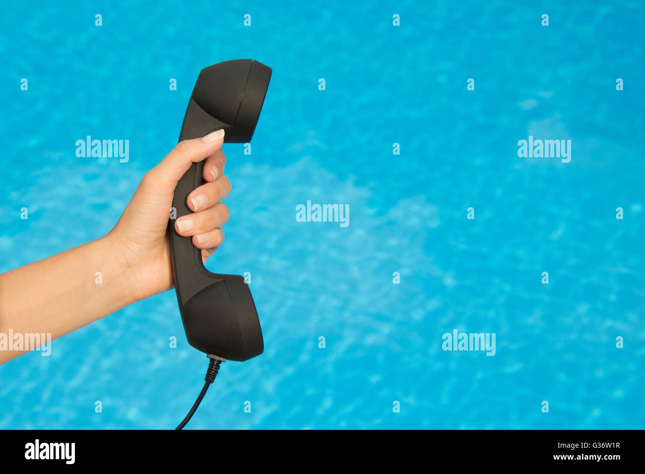 Hand holding retro landline telephone receiver Stock Photo - Alamy