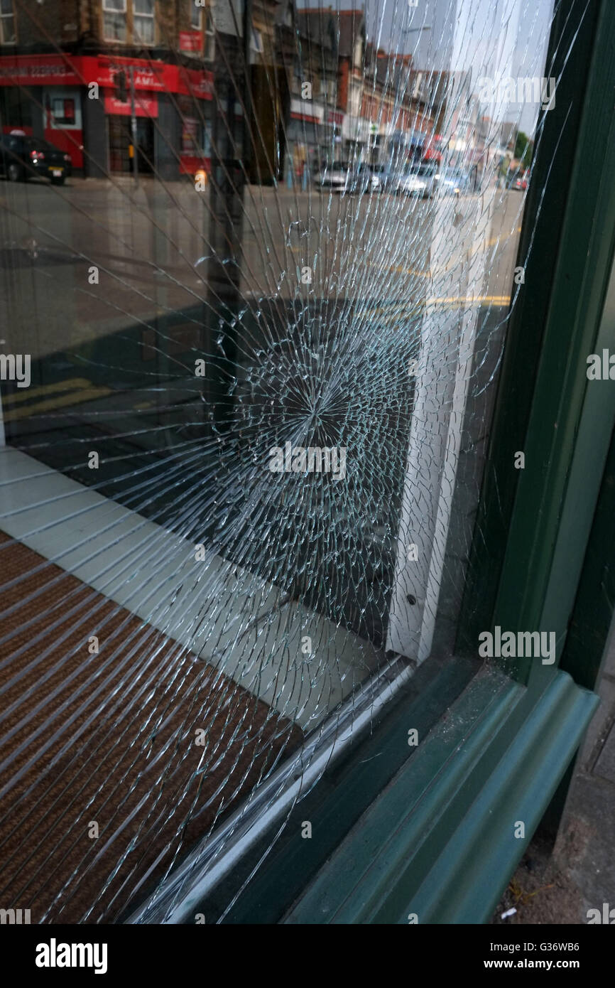 Busted shop window on City Road, Cardiff. 8th June 2016 Stock Photo - Alamy
