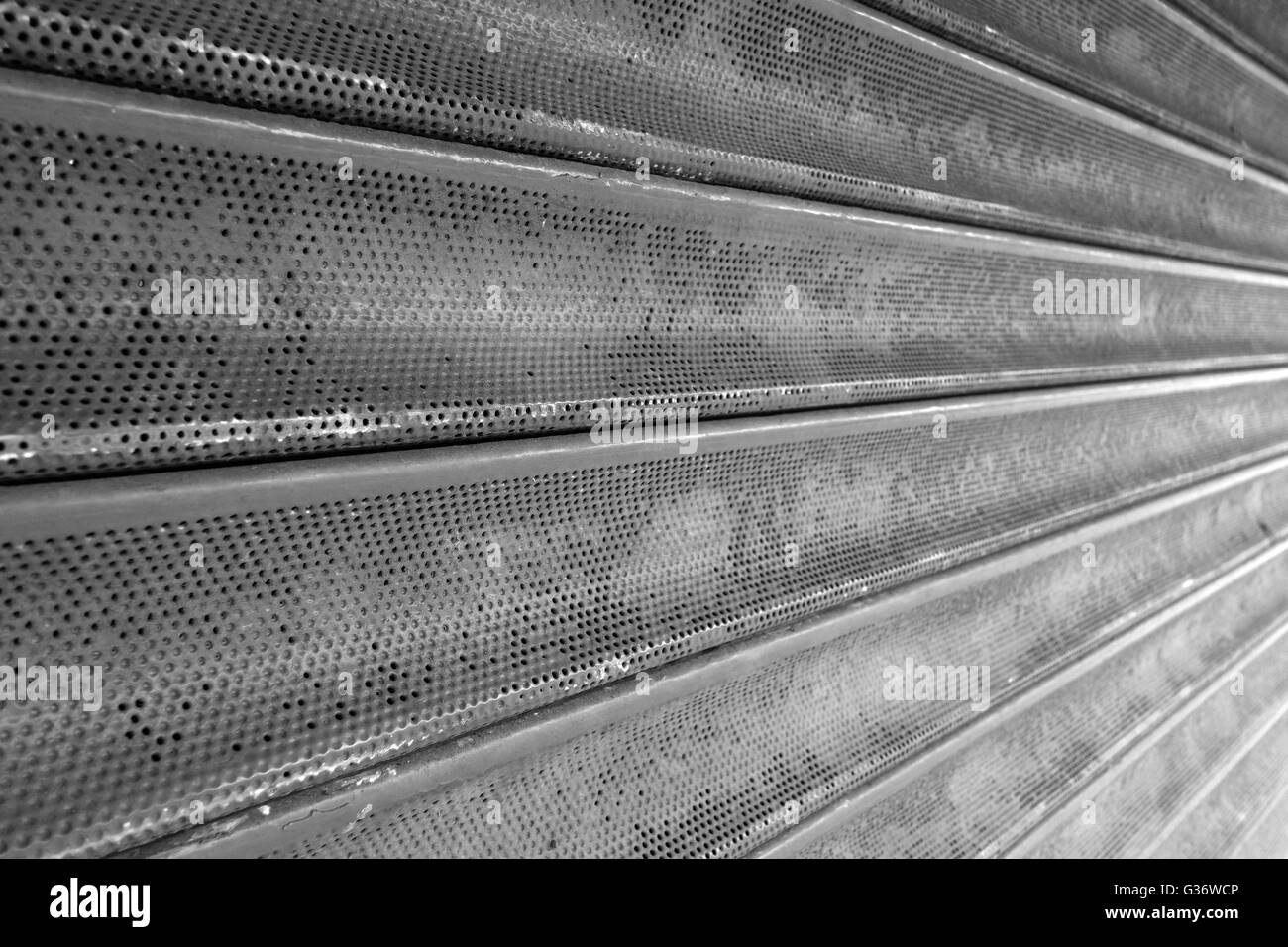 Old shop front shutter with line running away from the view point. June ...