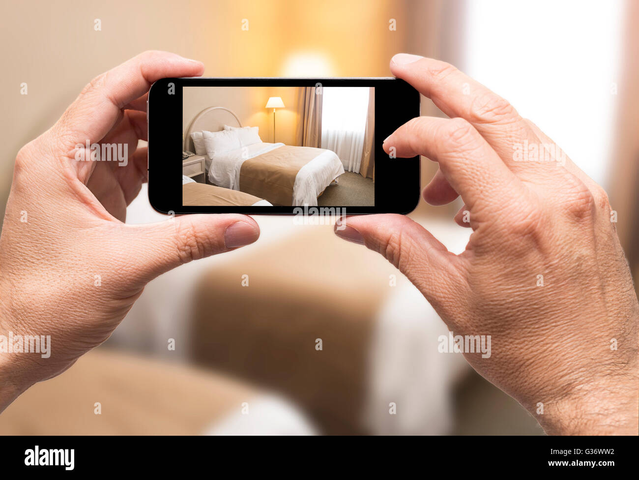 Taking picture in hotel room with smartphone Stock Photo - Alamy
