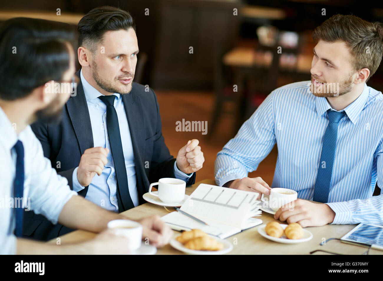 Talking by cup of coffee Stock Photo - Alamy