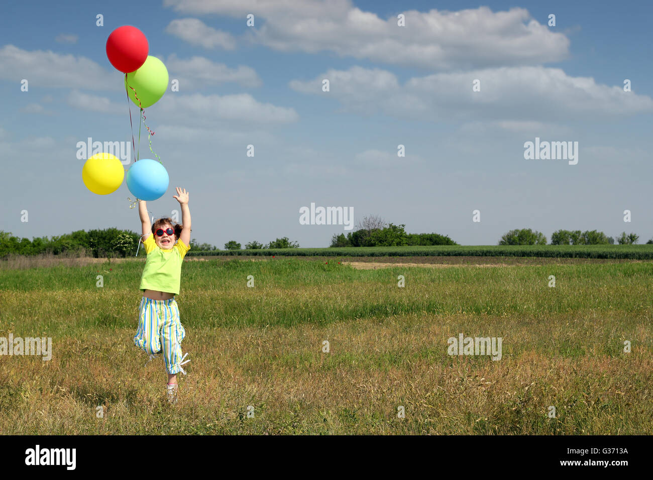 happy little girl jump Stock Photo - Alamy