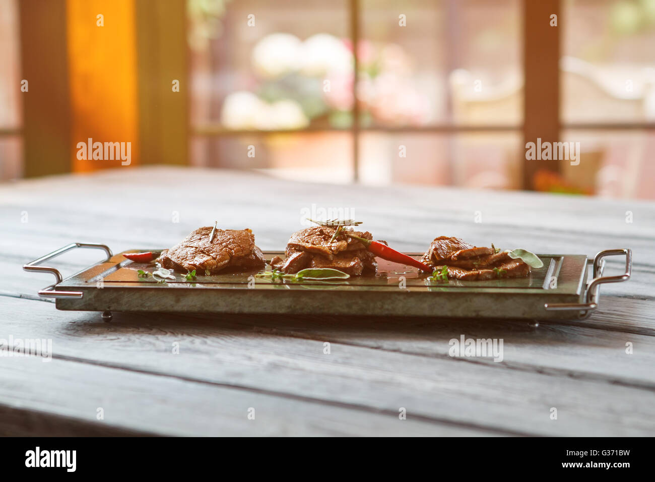 Tray with pieces of meat Stock Photo - Alamy