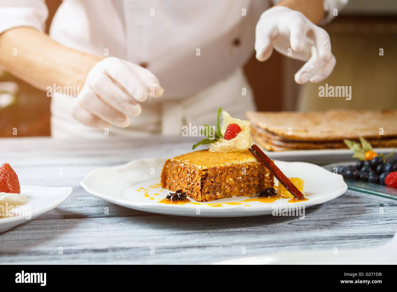 Hands near plate with cake Stock Photo - Alamy