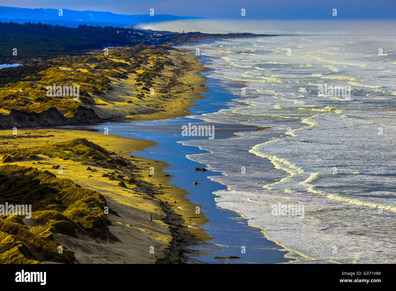 Surf rolling onto expansive sand beach on the Oregon Coast Stock Photo ...
