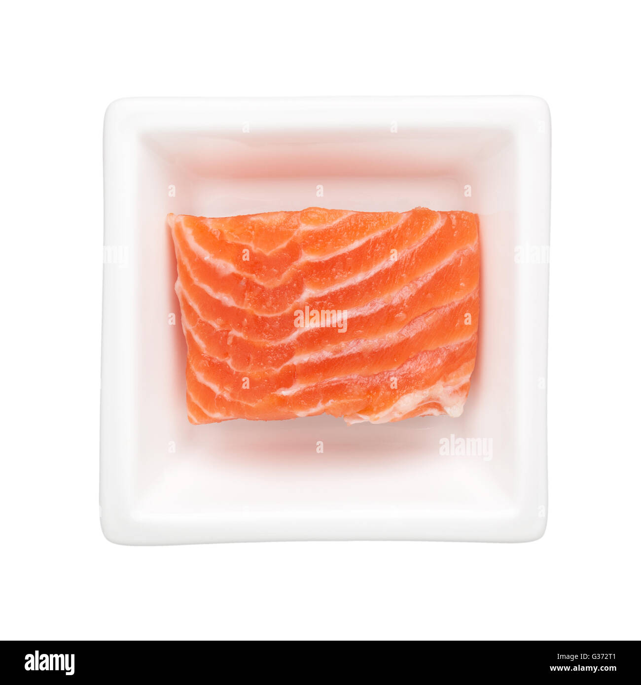 Salmon fillet in a square bowl isolated on white background Stock Photo ...