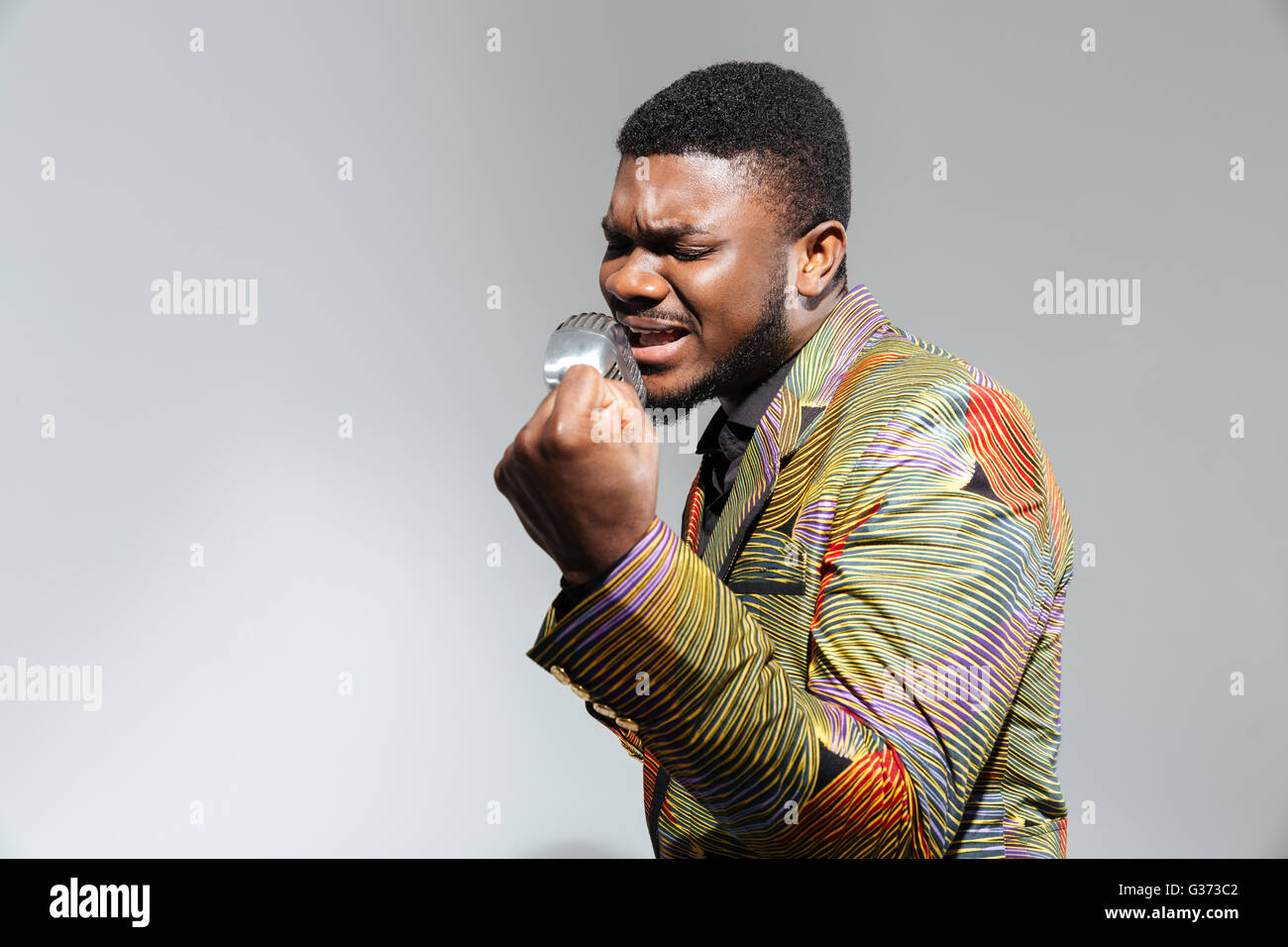 Black man holding microphone isolated hi-res stock photography and ...