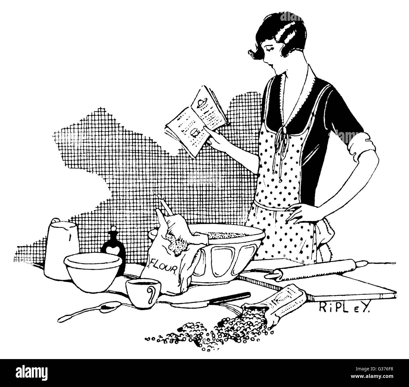 COOKING FROM A BOOK Stock Photo - Alamy