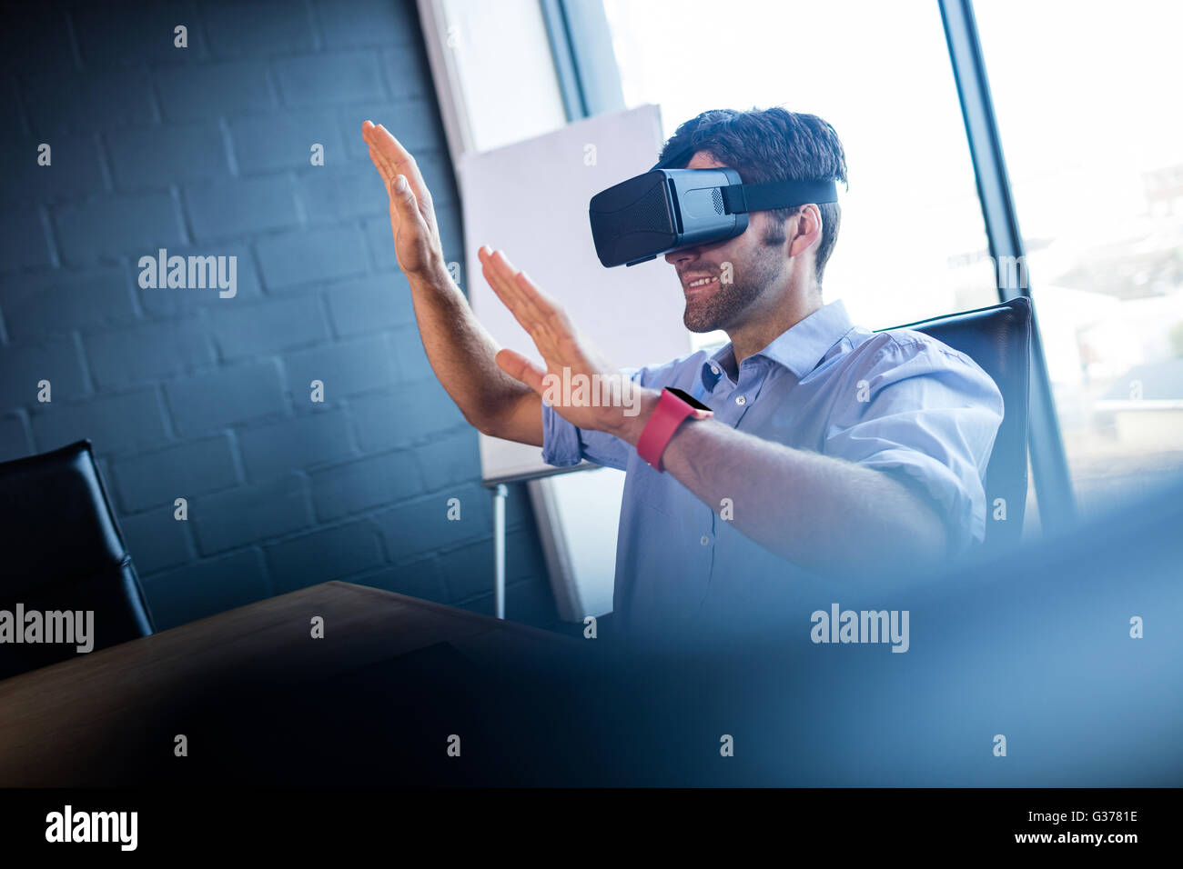 Businessman using virtual reality device Stock Photo - Alamy