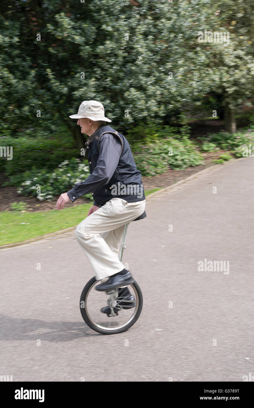 Man riding unicycle hi-res stock photography and images - Alamy