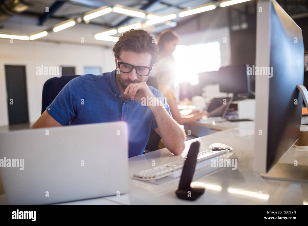 Casual businessman using technology Stock Photo - Alamy