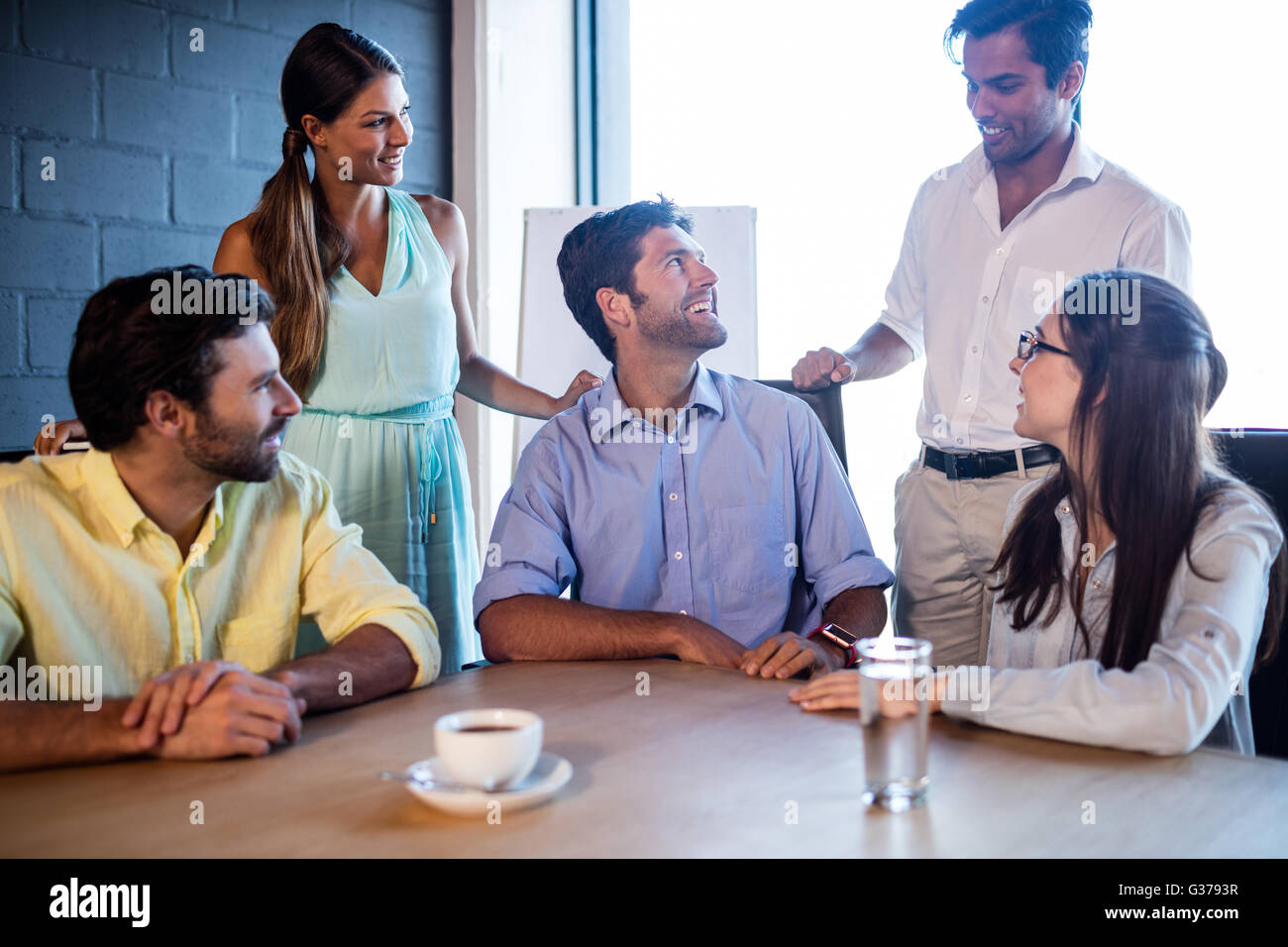 Working around a table hi-res stock photography and images - Alamy