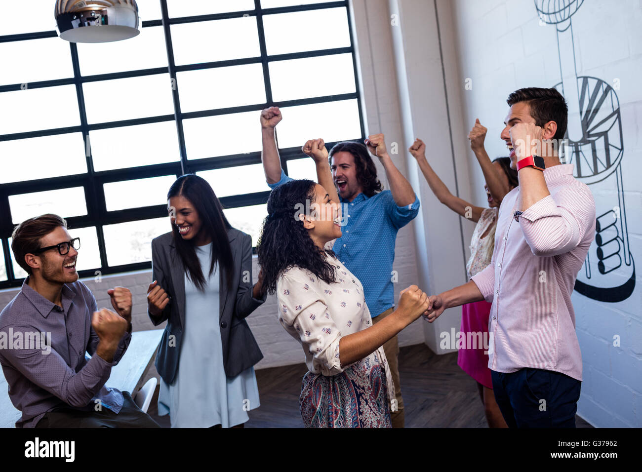 Group of coworkers smiling and successful Stock Photo - Alamy