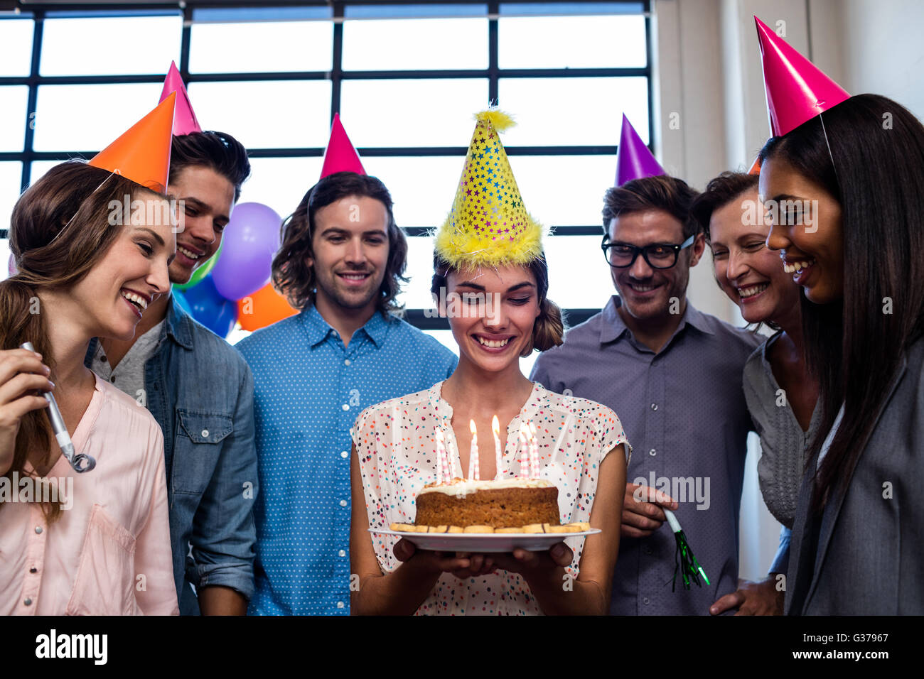 Happy coworkers celebrating a birthday Stock Photo - Alamy