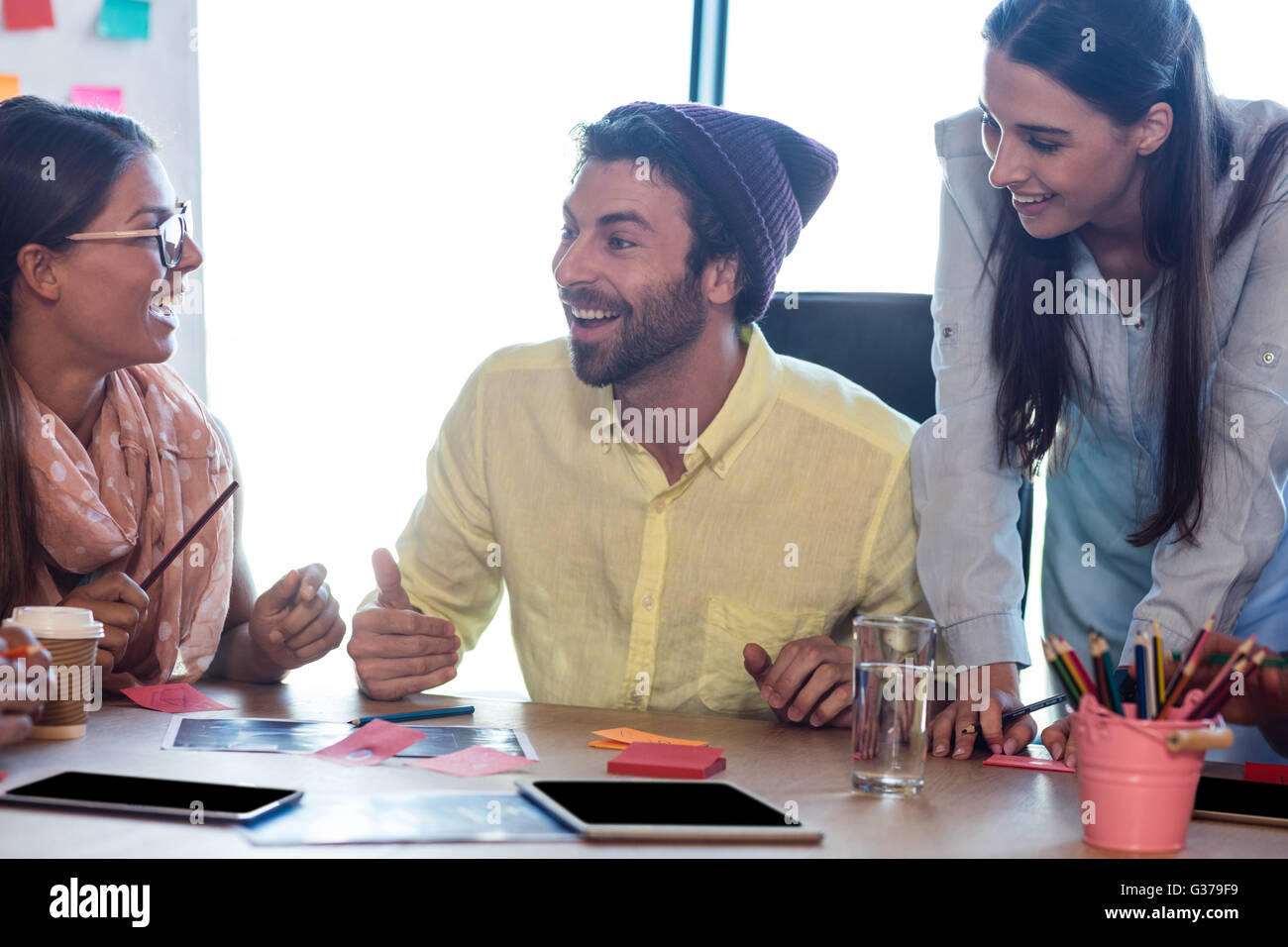 Smiling designers at work Stock Photo - Alamy