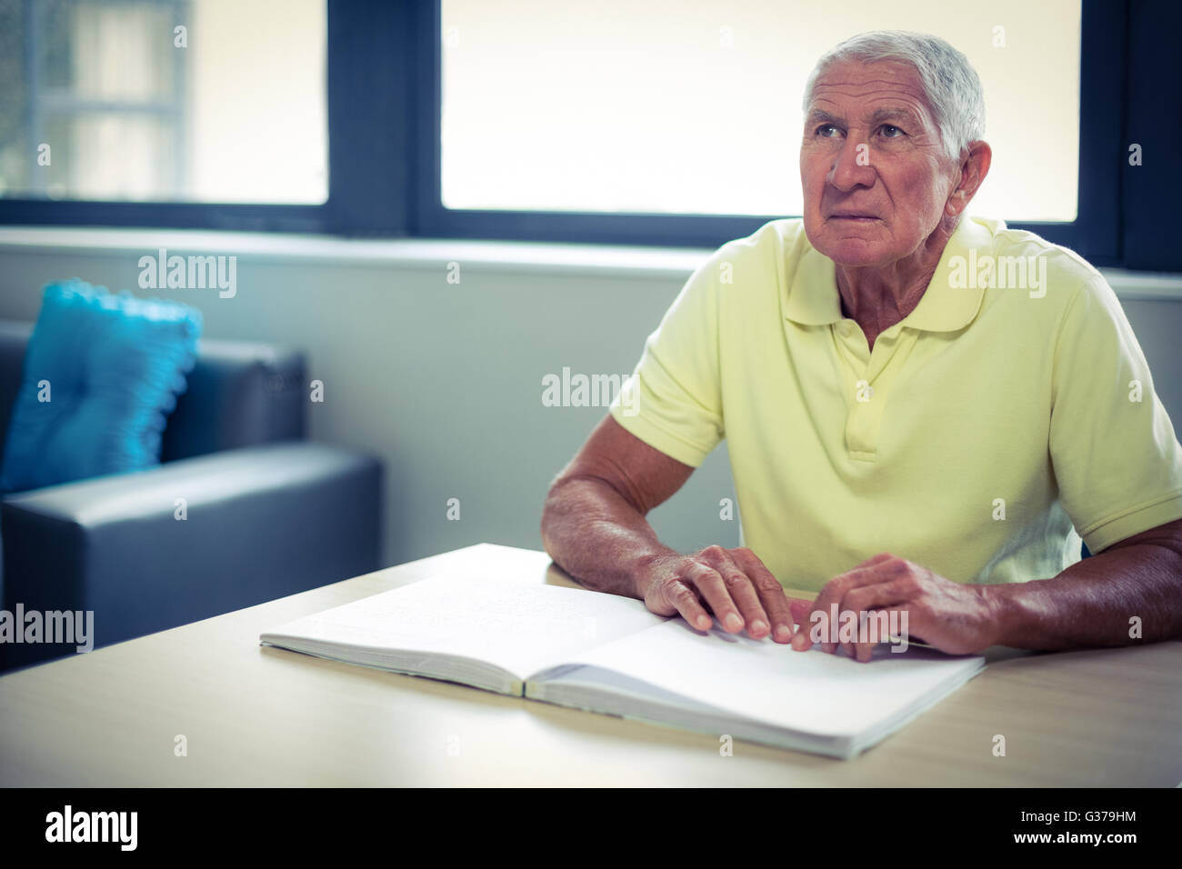 Senior blind man reading a braille book Stock Photo - Alamy
