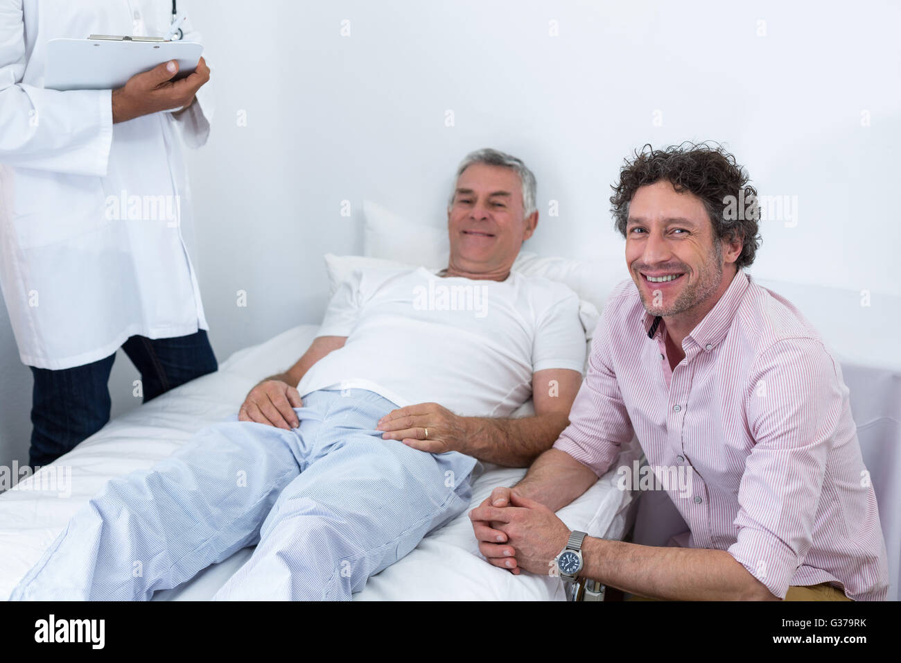 Cheerful patient next doctor hi-res stock photography and images - Alamy