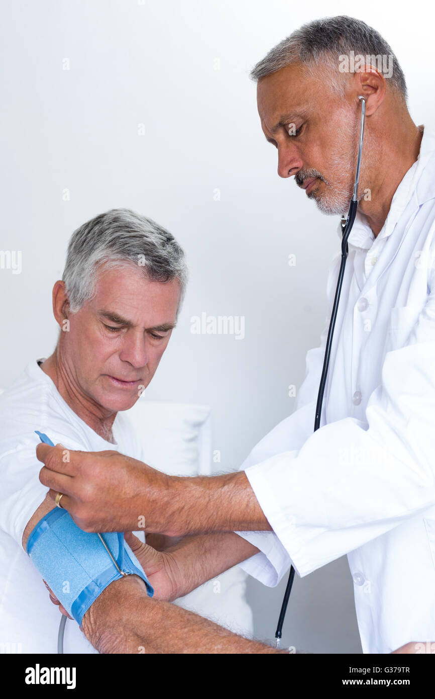 Doctor checking up hi-res stock photography and images - Alamy