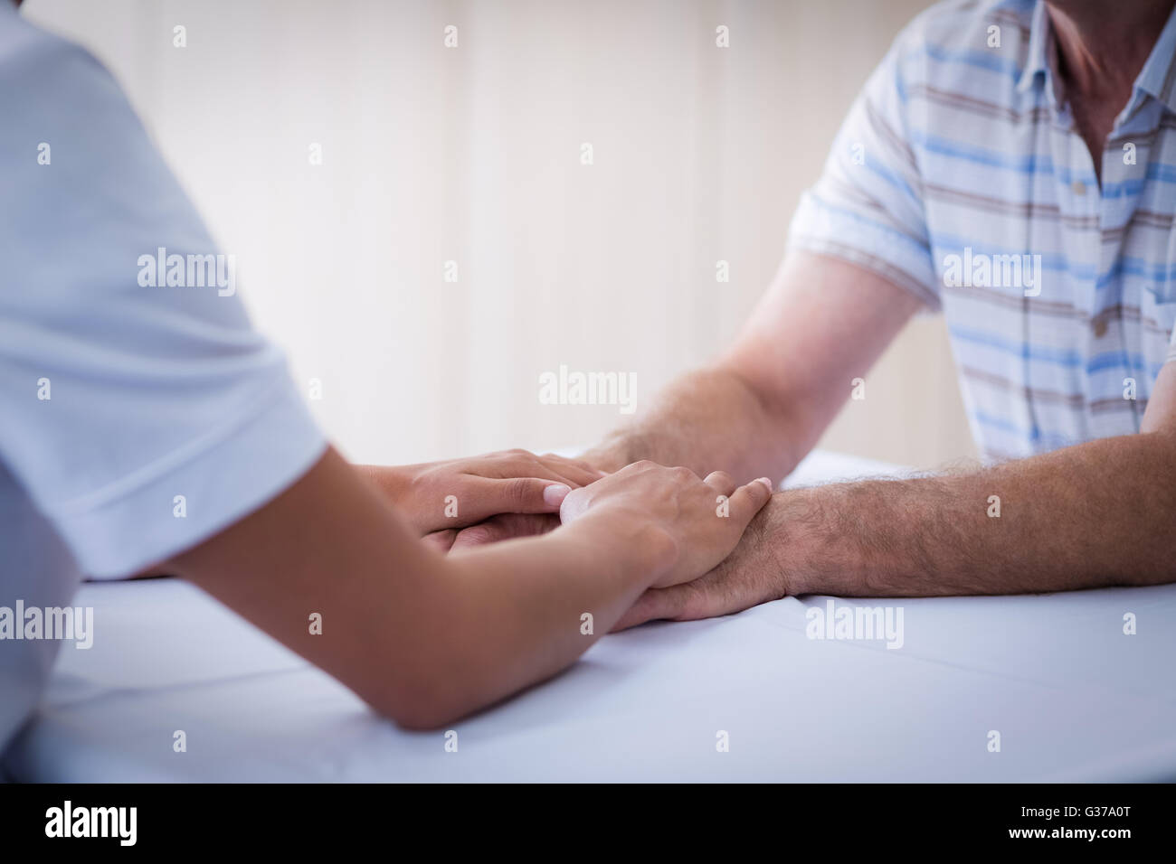 Senior man consoling to woman hi-res stock photography and images - Alamy