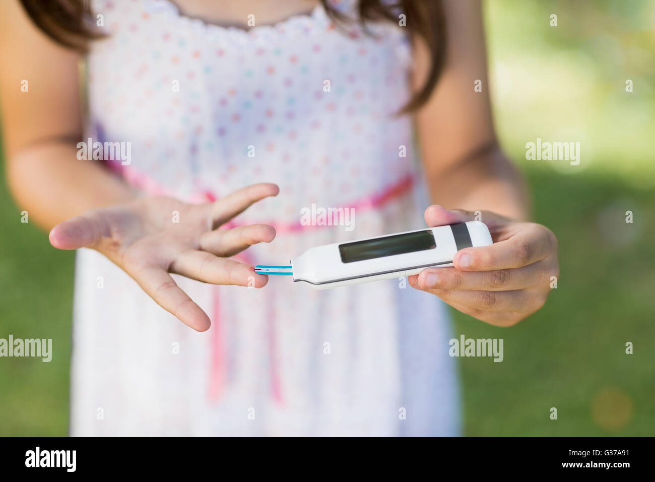 Child with blood glucose meter hi-res stock photography and images - Alamy