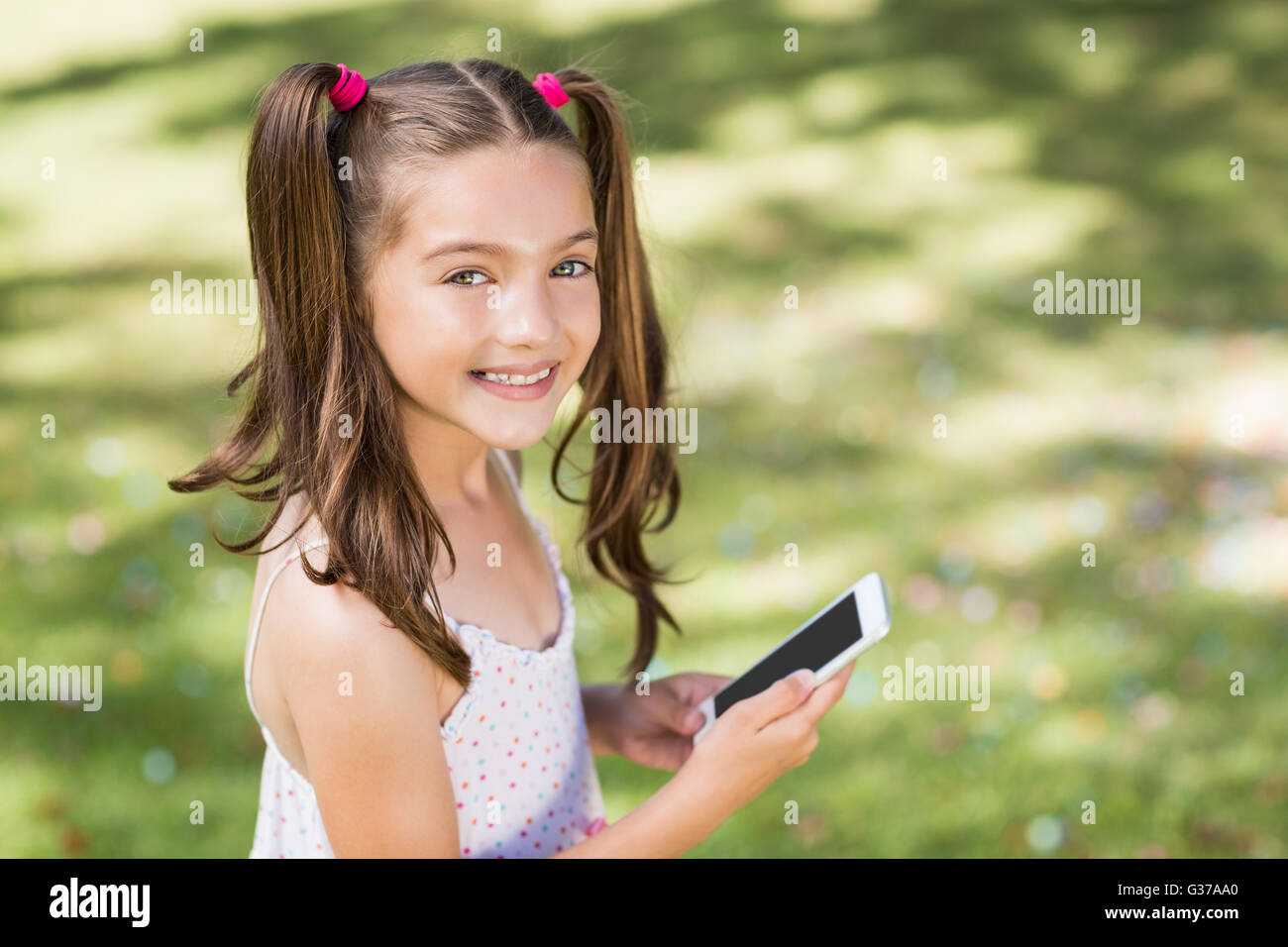 Young smiling girl with mobile hi-res stock photography and images - Alamy