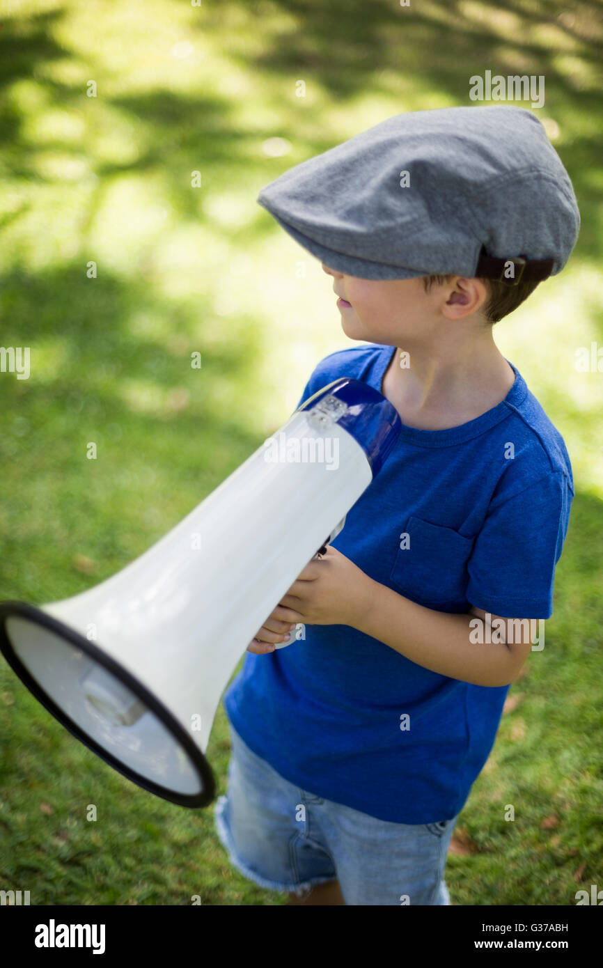 Young boy holding a megaphone Stock Photo - Alamy