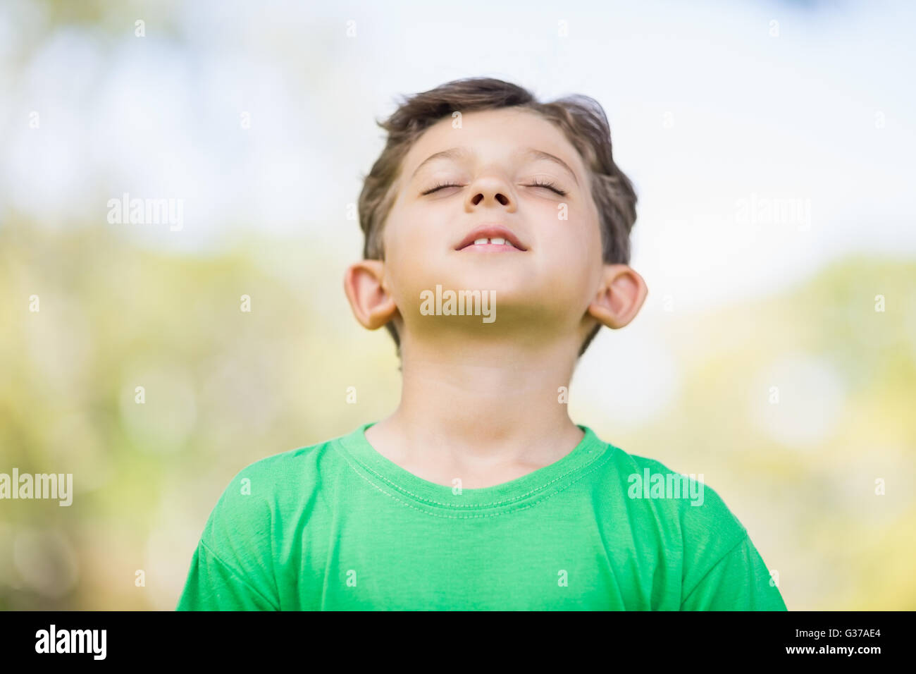 Young boy with eyes closed Stock Photo - Alamy