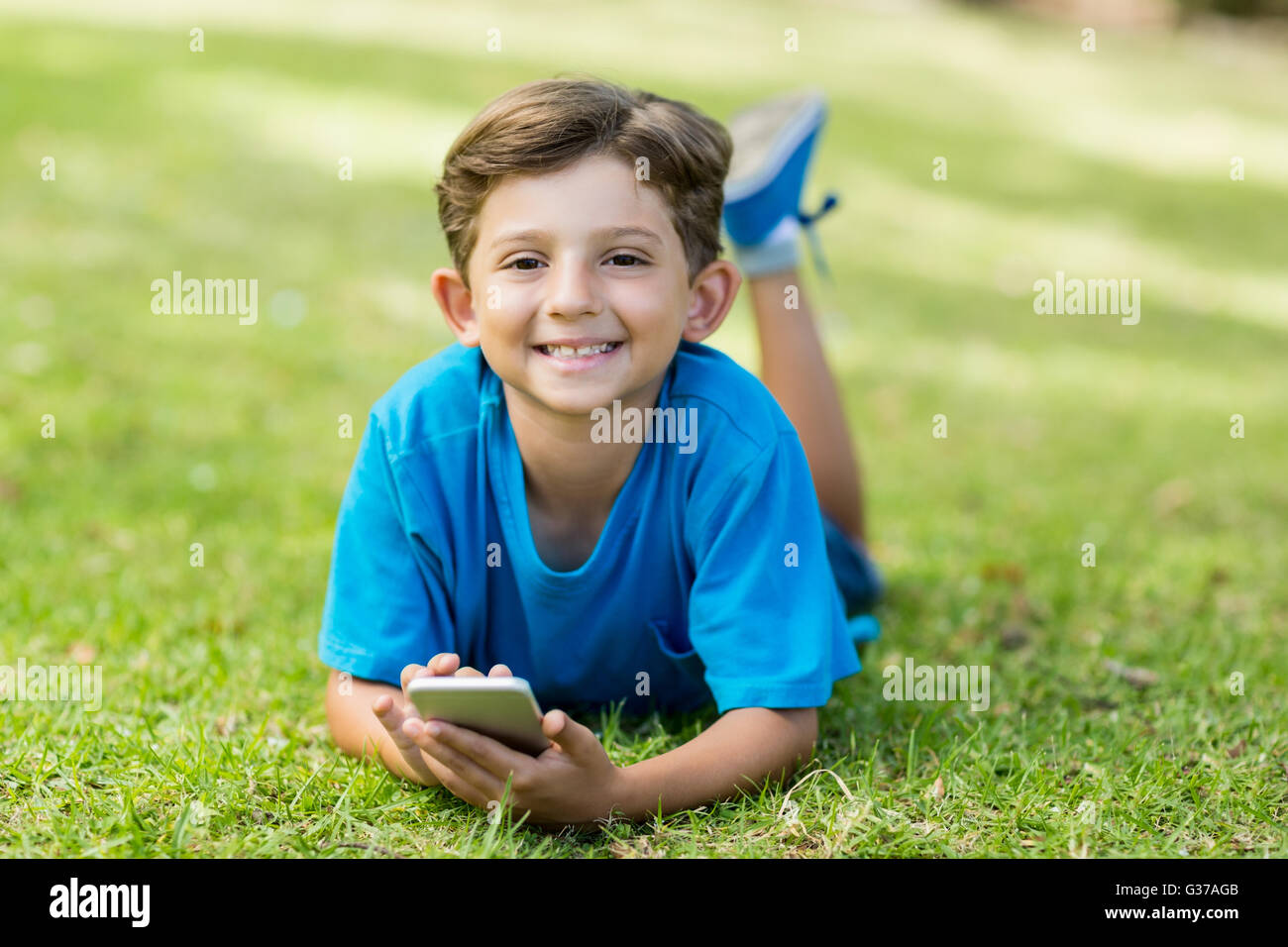 Young boy using mobile phone Stock Photo - Alamy