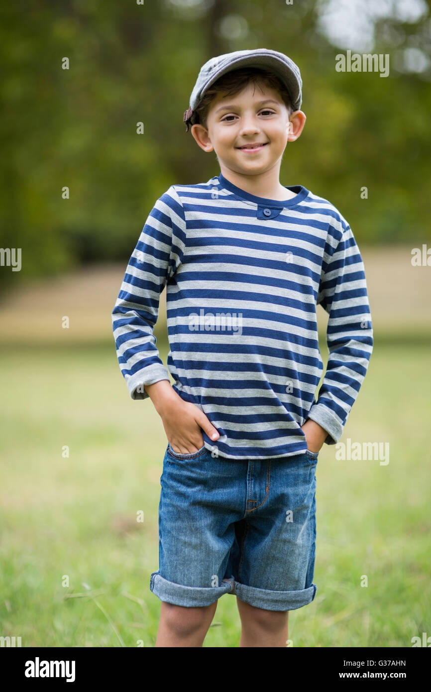 Smiling boy standing with hands in pocket Stock Photo - Alamy