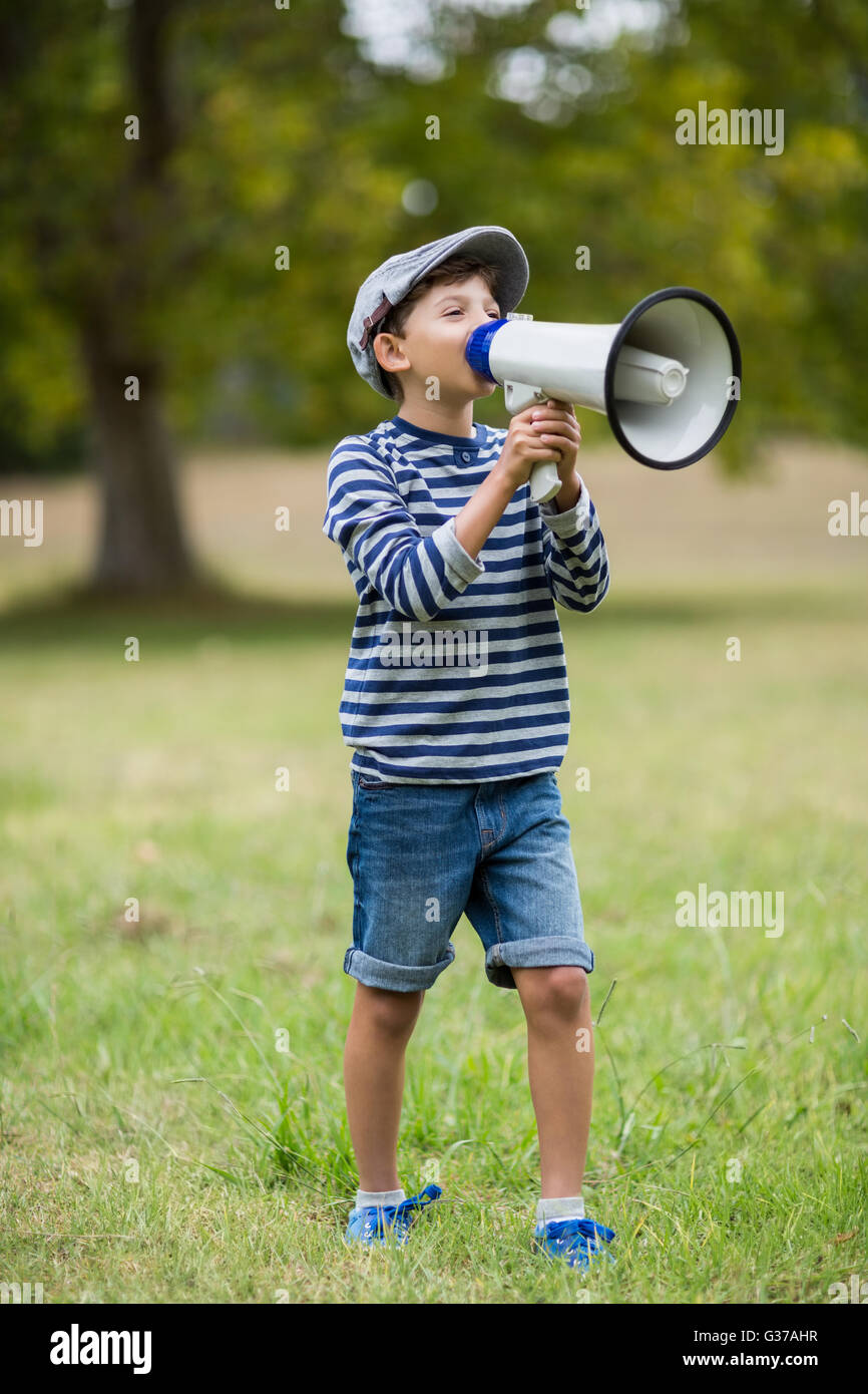 Boy speaking on megaphone Stock Photo - Alamy