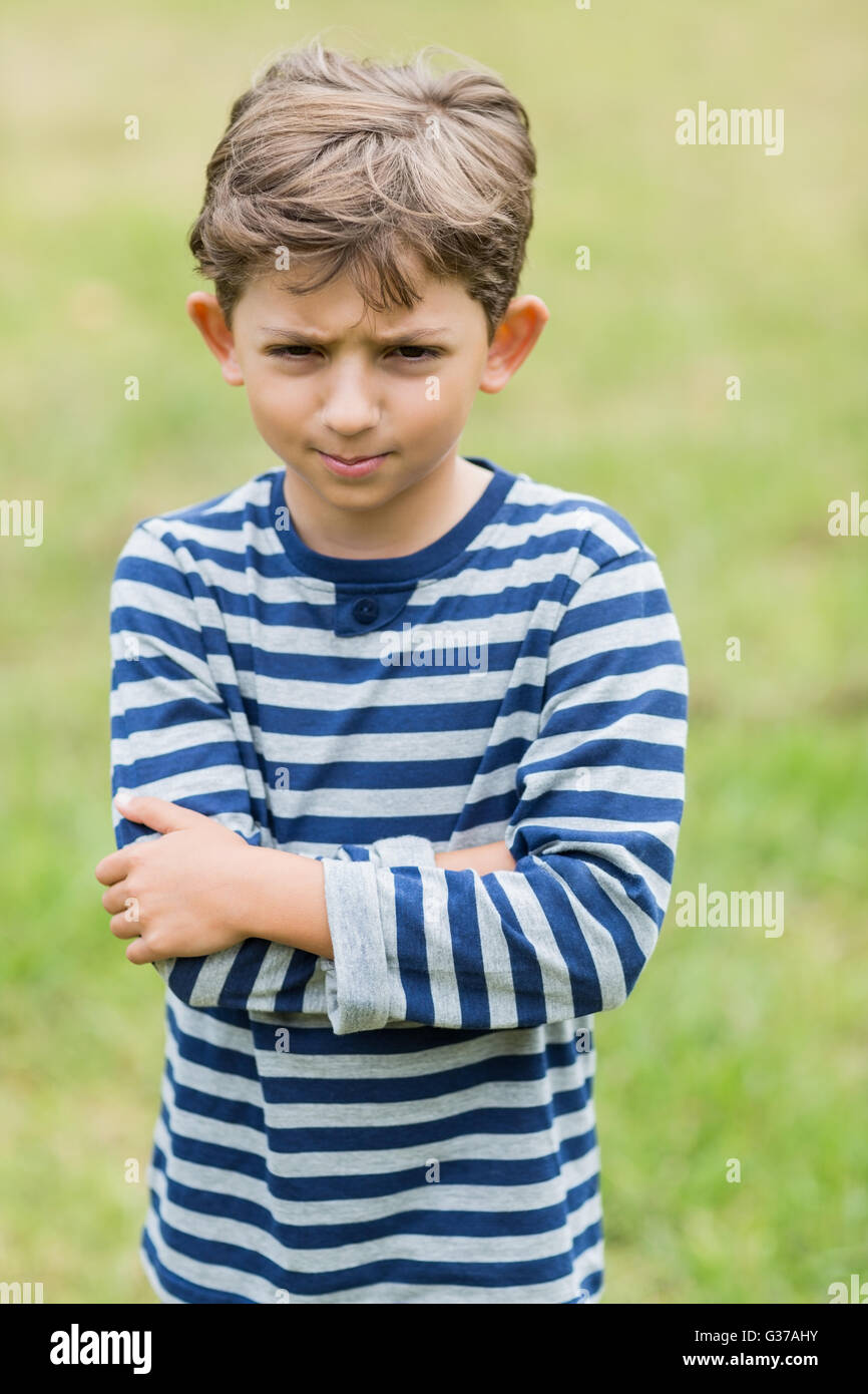 Boy standing arms crossed hi-res stock photography and images - Alamy