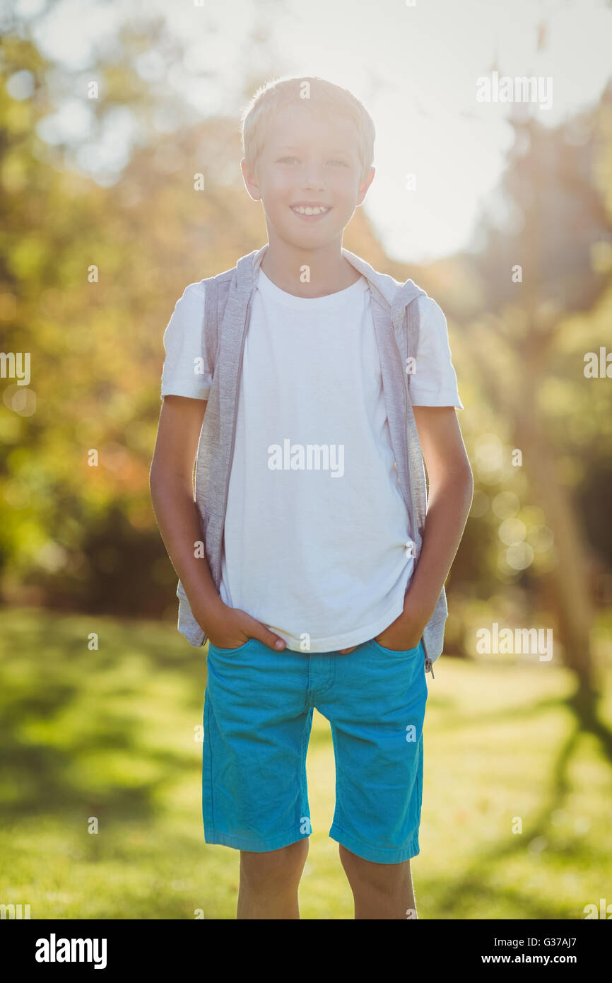 Smiling boy standing with hands in pocket Stock Photo - Alamy