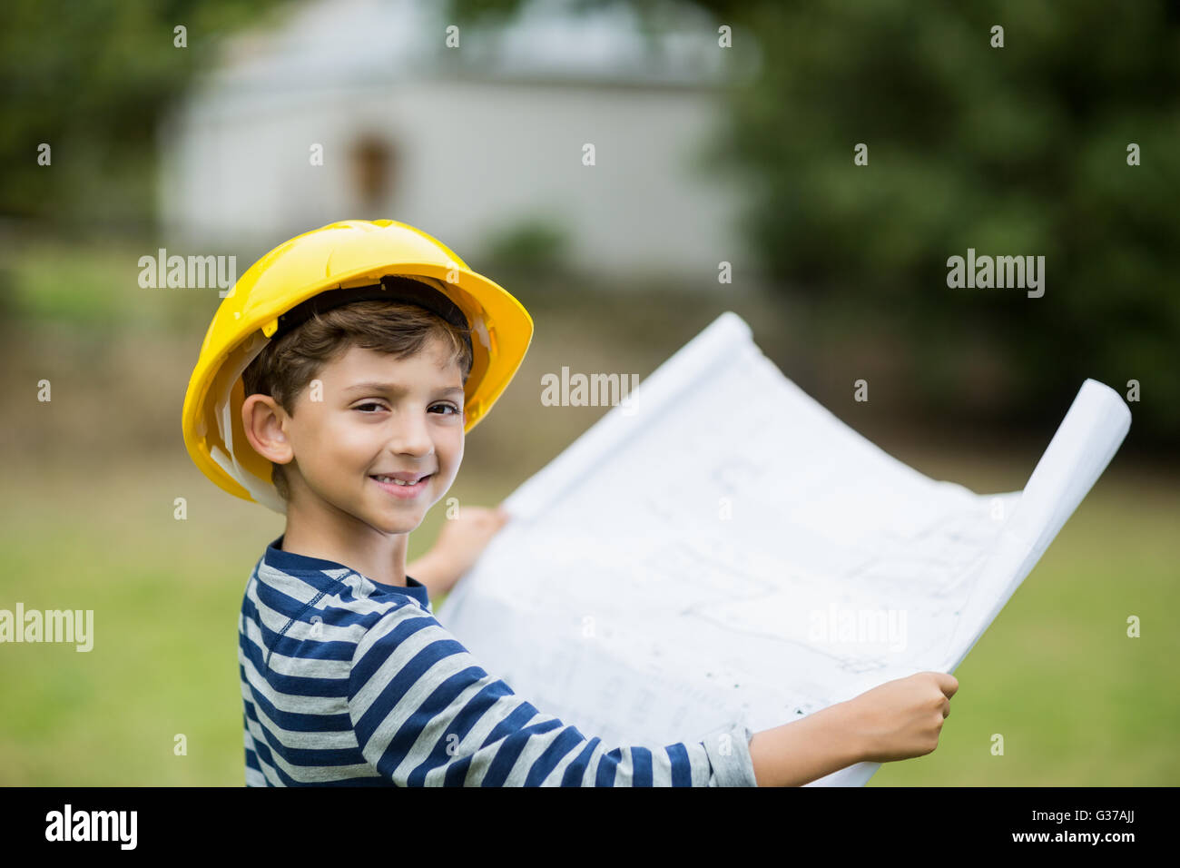 Child architect blueprints hard hat hi-res stock photography and images ...