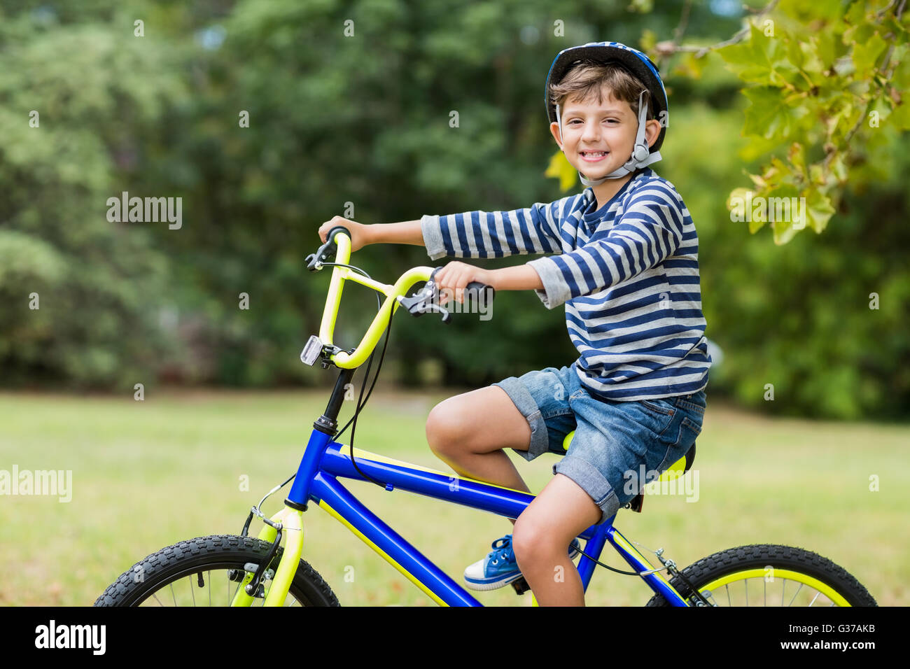 Boy riding his bicycle hi-res stock photography and images - Alamy