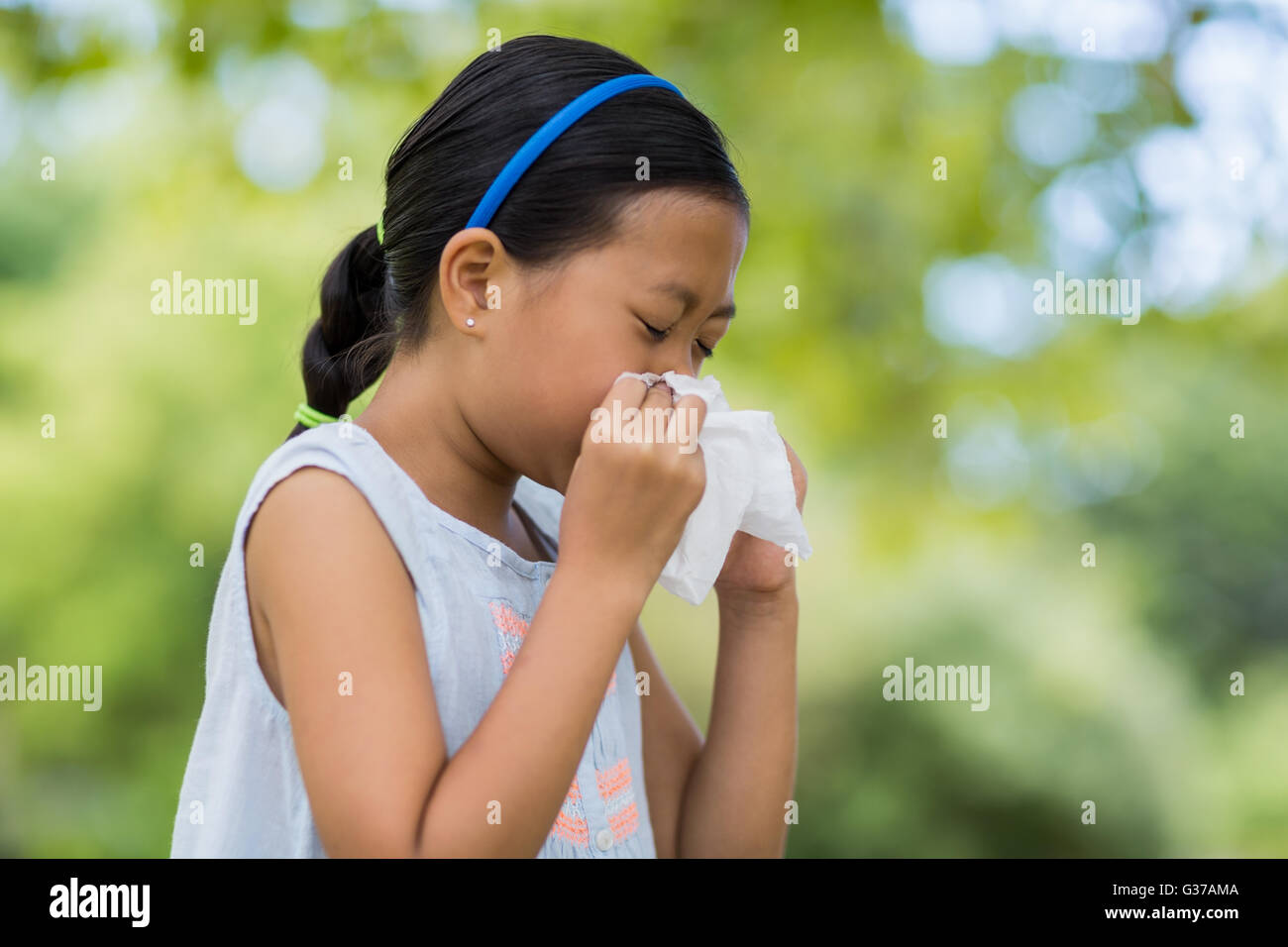 Asian girl blowing nose hi-res stock photography and images - Alamy
