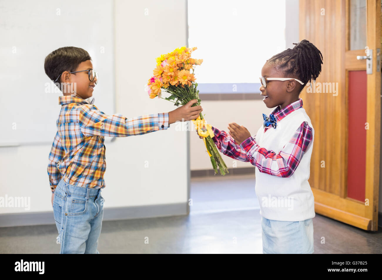 Boy giving flower girl hi-res stock photography and images - Alamy