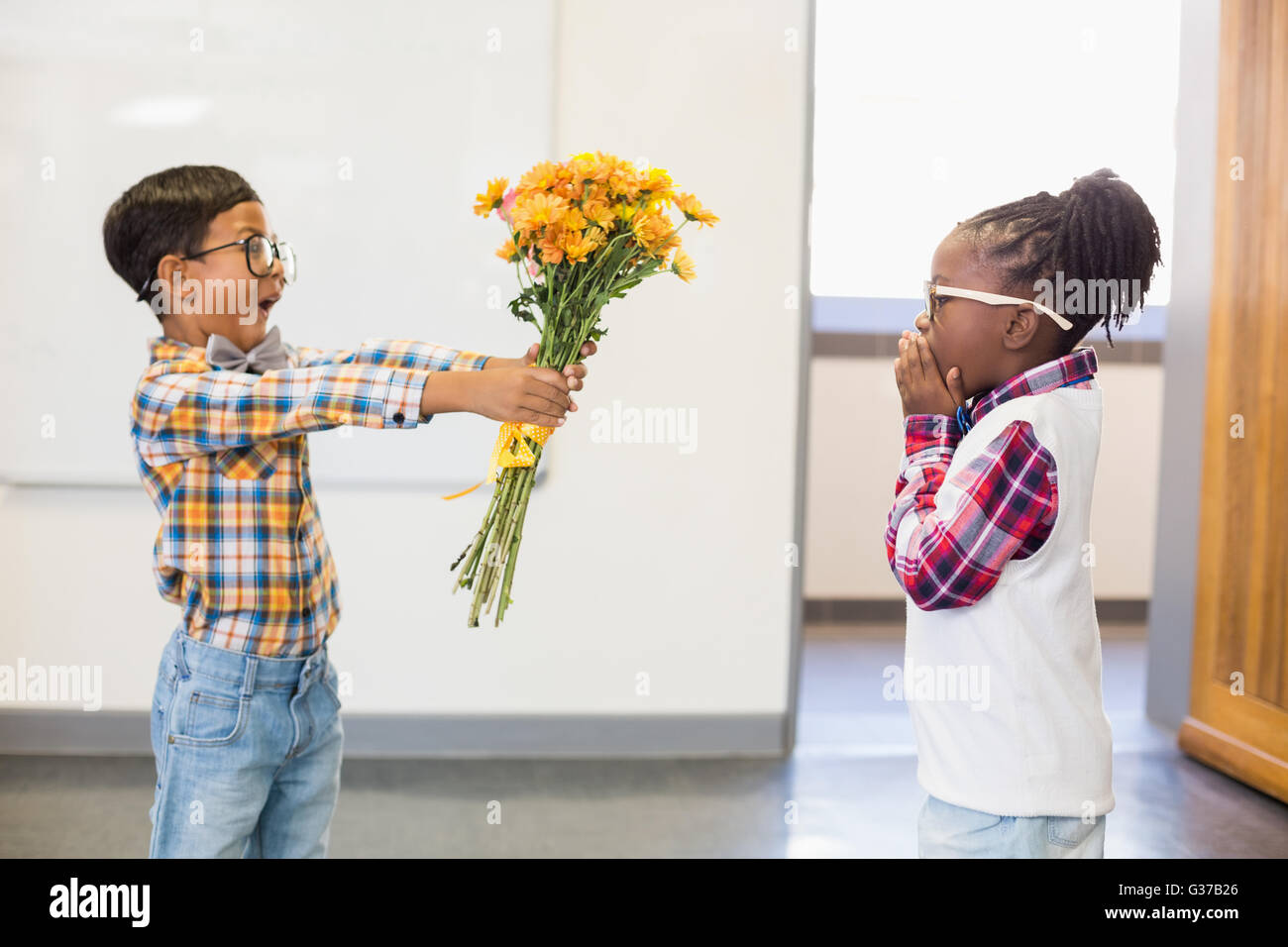 Boy giving flower girl hi-res stock photography and images - Alamy