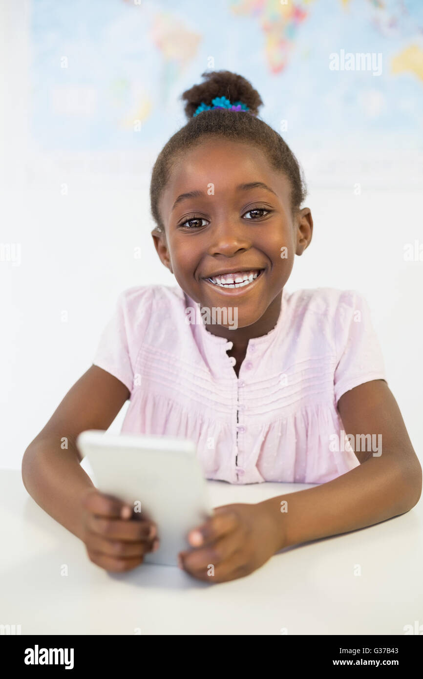 Happy schoolgirl using mobile phone hi-res stock photography and images ...