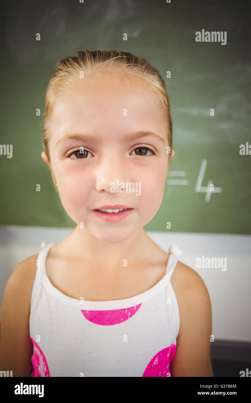 Portrait of happy schoolgirl smiling in classroom Stock Photo - Alamy