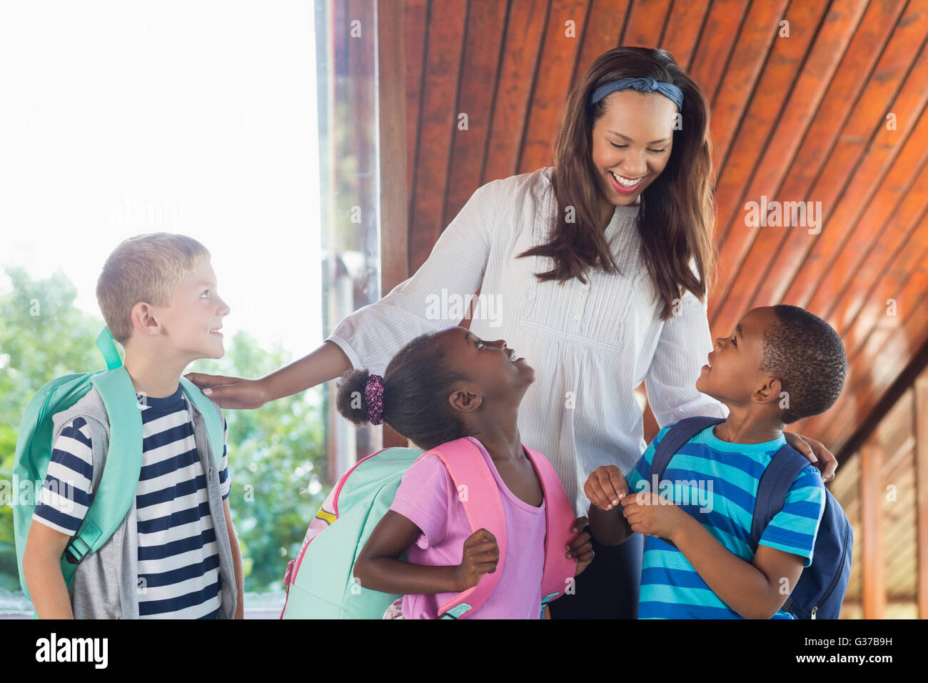 Male teacher and boy talking hi-res stock photography and images - Alamy