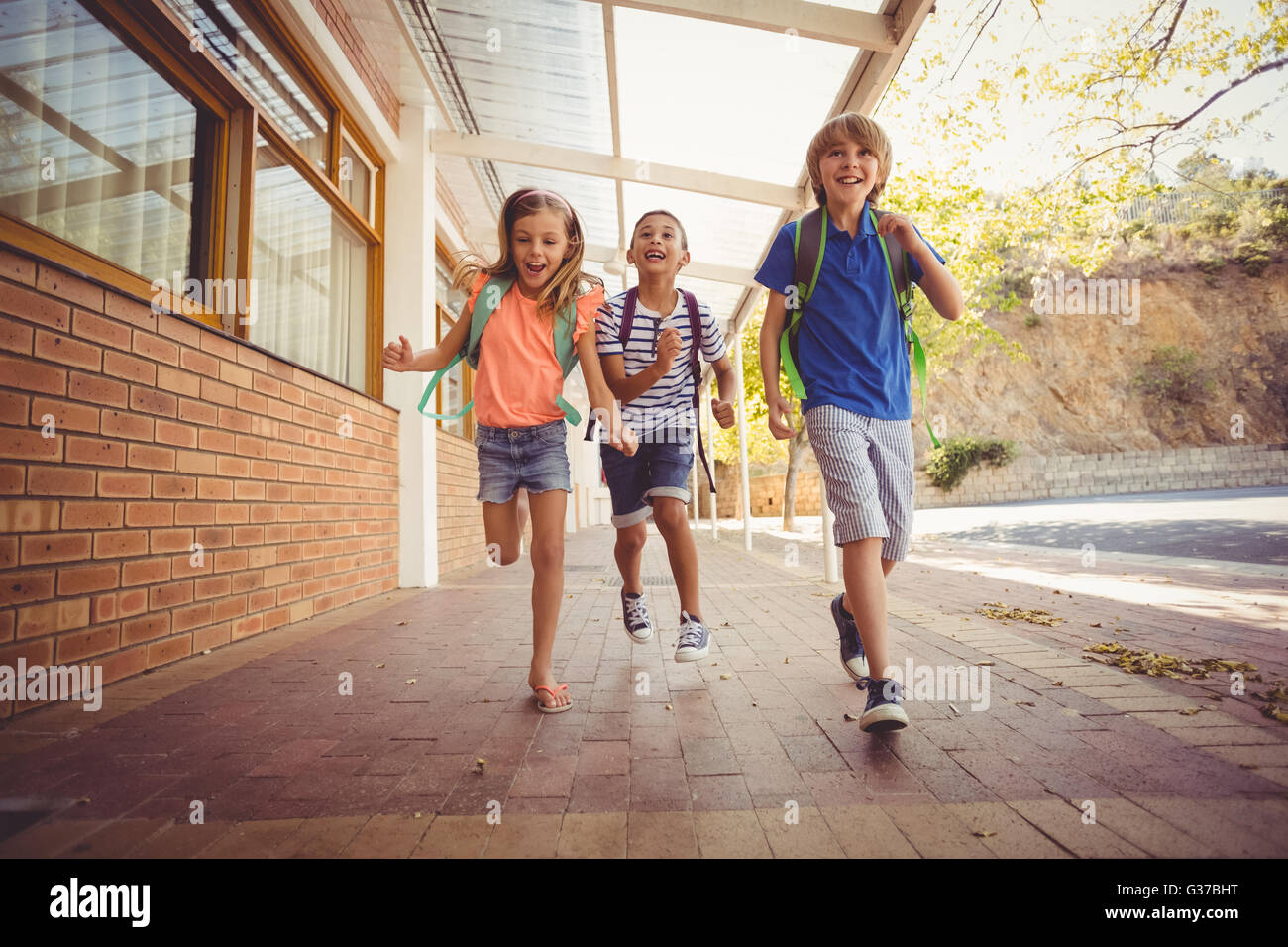 Running school girl hi-res stock photography and images - Alamy