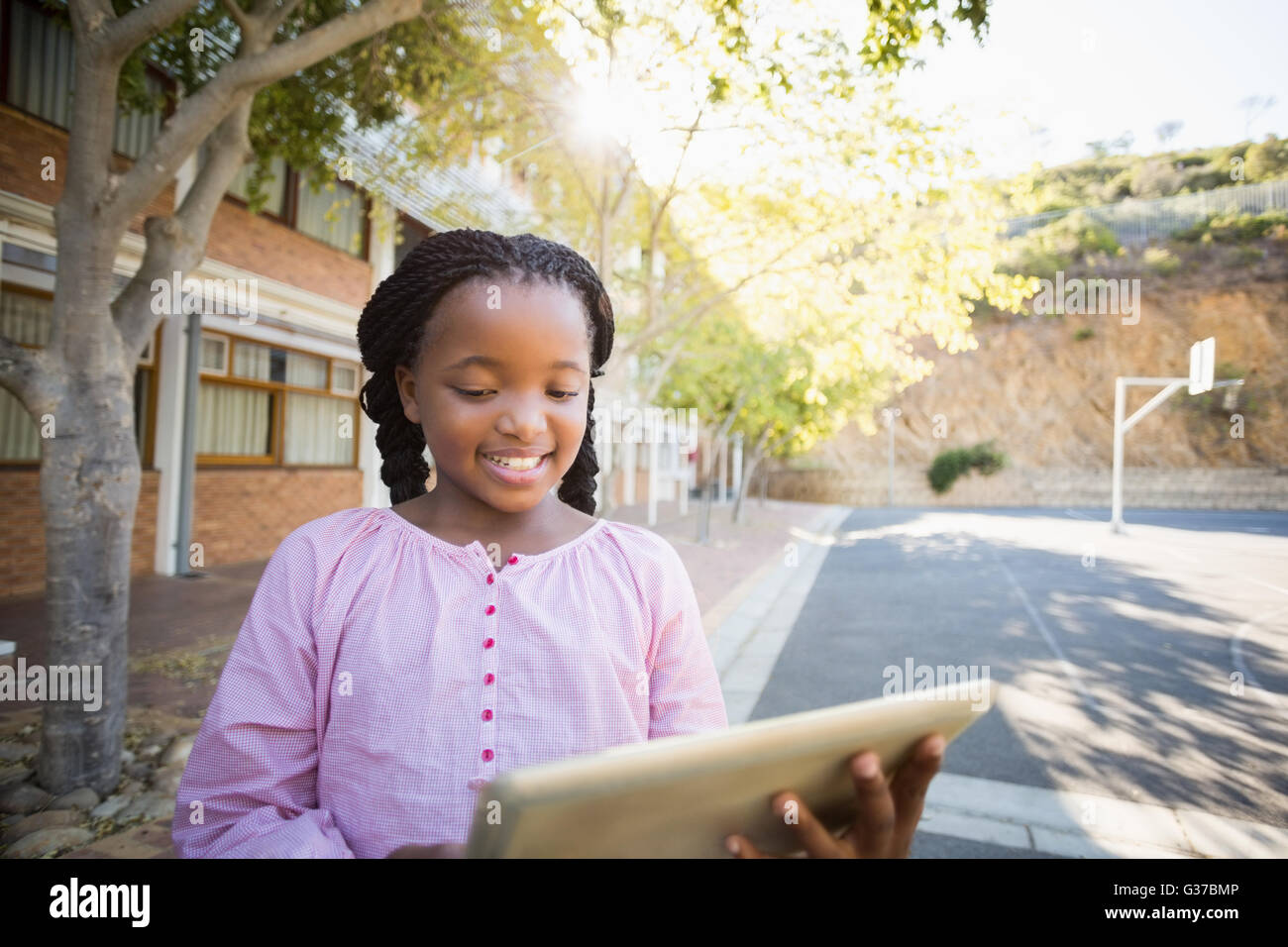Girl standing happy school hi-res stock photography and images - Alamy