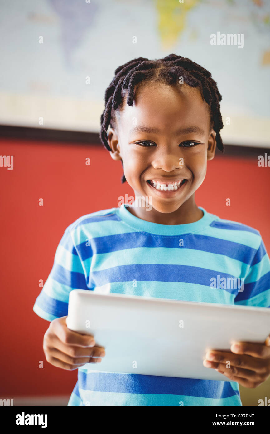 Child holding tablet in classroom hi-res stock photography and images ...