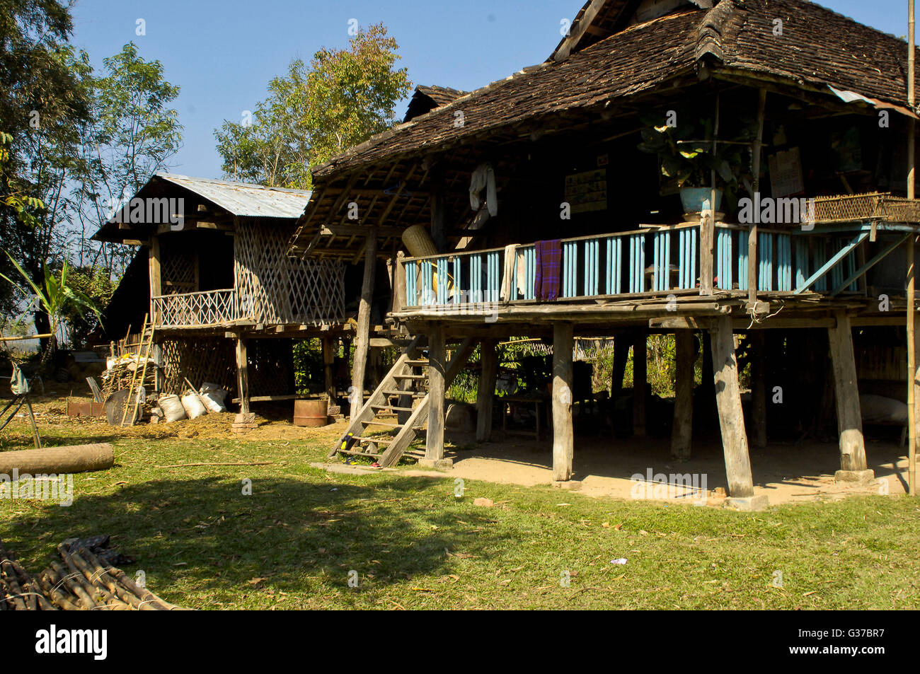 Houses in a typical AKHA village near KENGTUNG also known as KYAINGTONG ...
