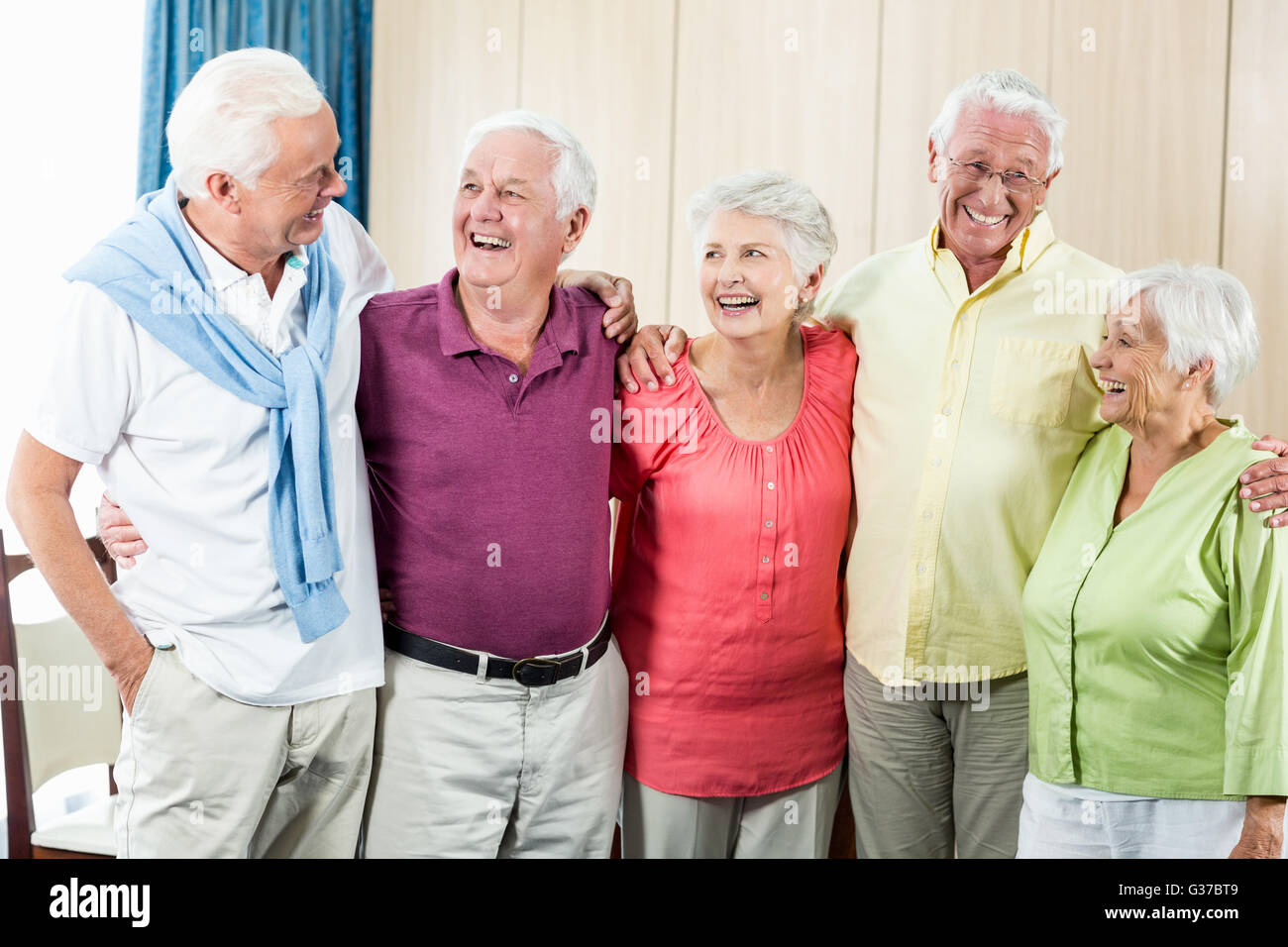 Seniors standing together Stock Photo - Alamy