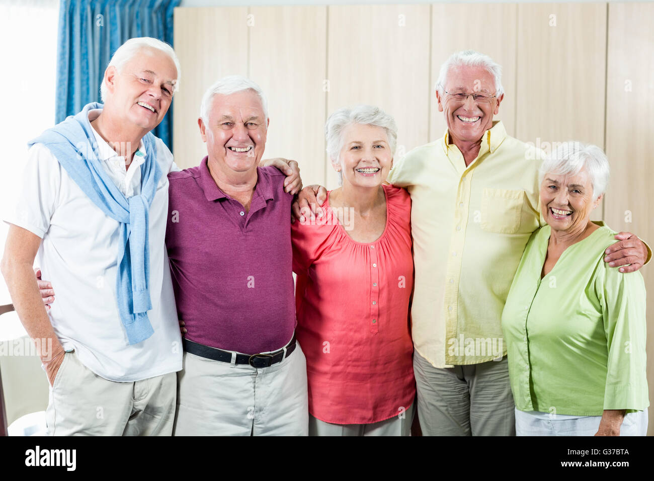 Seniors standing together Stock Photo - Alamy