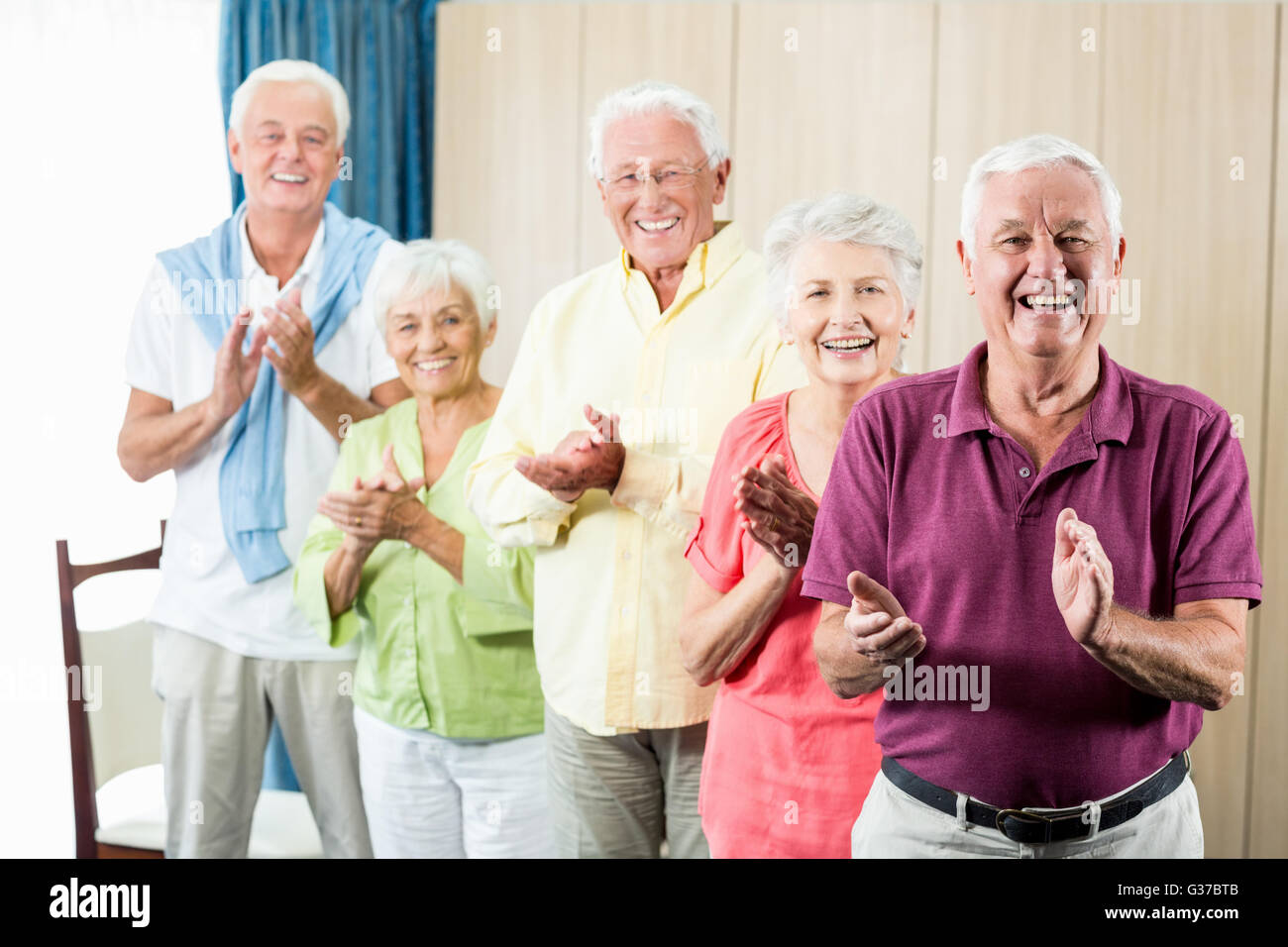 Seniors clapping hands Stock Photo - Alamy