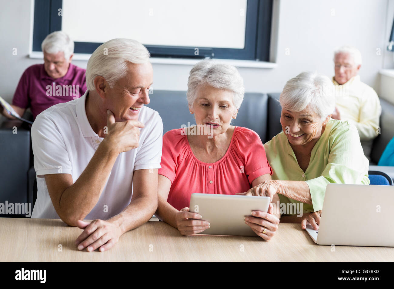 Seniors using technology Stock Photo - Alamy