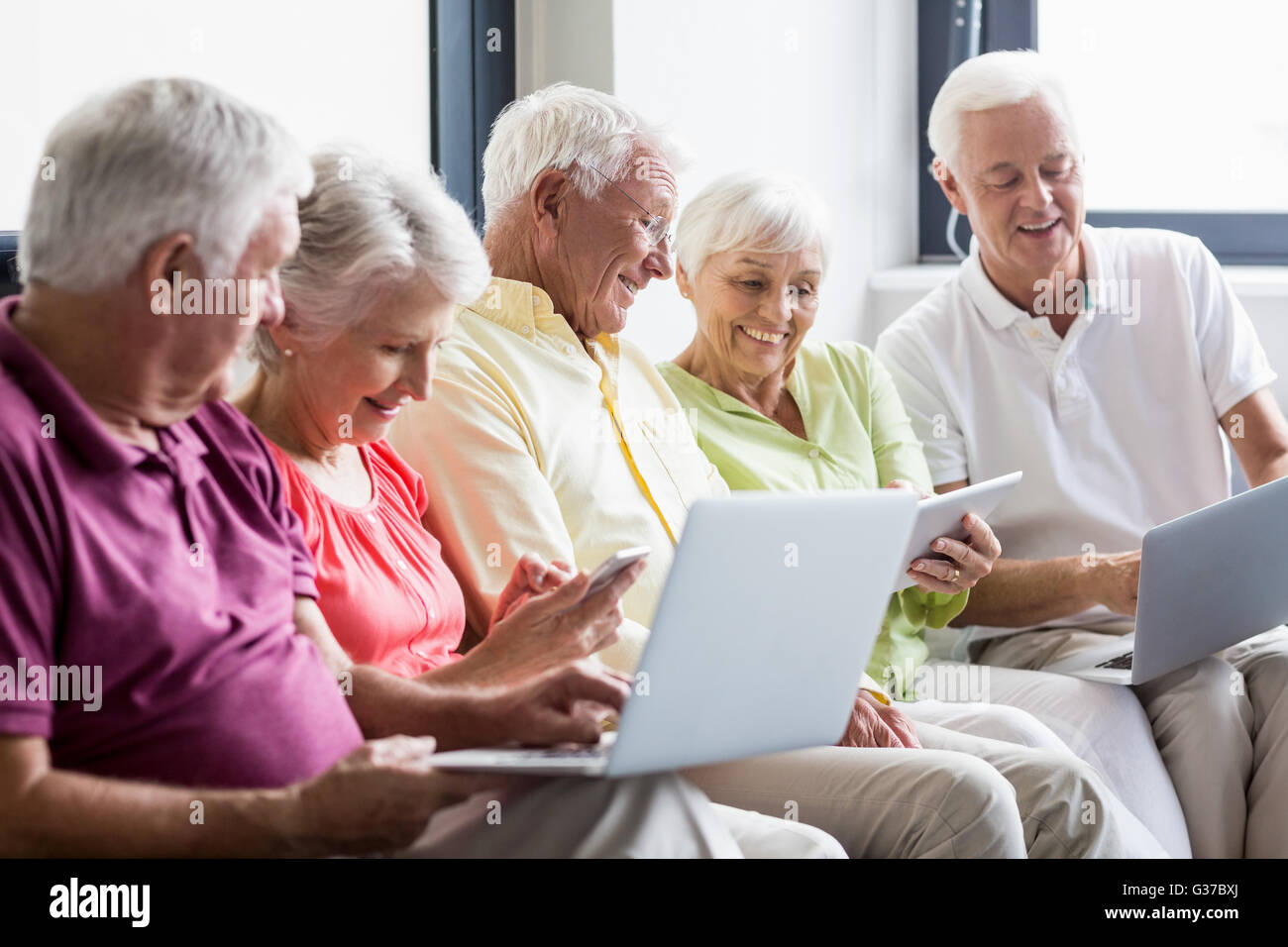 Seniors using technology Stock Photo - Alamy